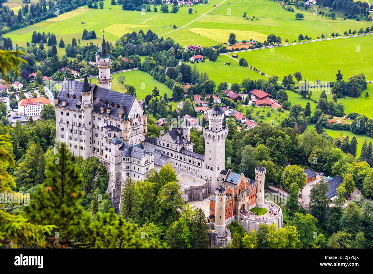 Famous Neuschwanstein Castle with scenic mountain landscape near Fussen ...
