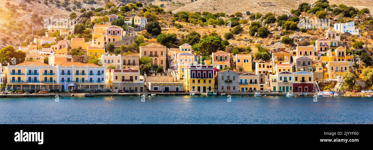 View of the beautiful greek island of Symi (Simi) with colourful houses ...