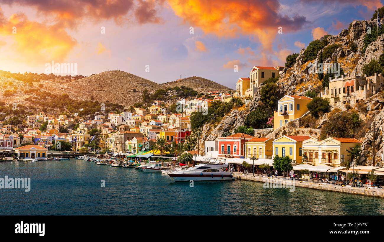View of the beautiful greek island of Symi (Simi) with colourful houses ...