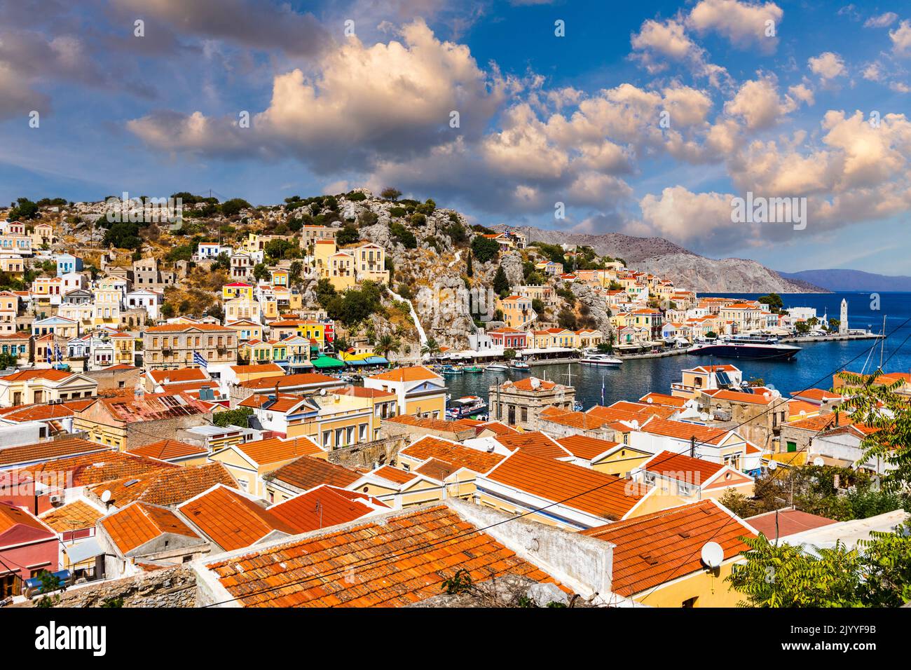 View of the beautiful greek island of Symi (Simi) with colourful houses ...