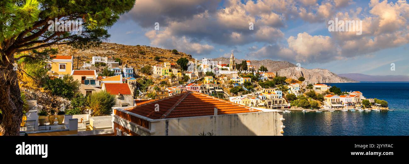 View of the beautiful greek island of Symi (Simi) with colourful houses ...
