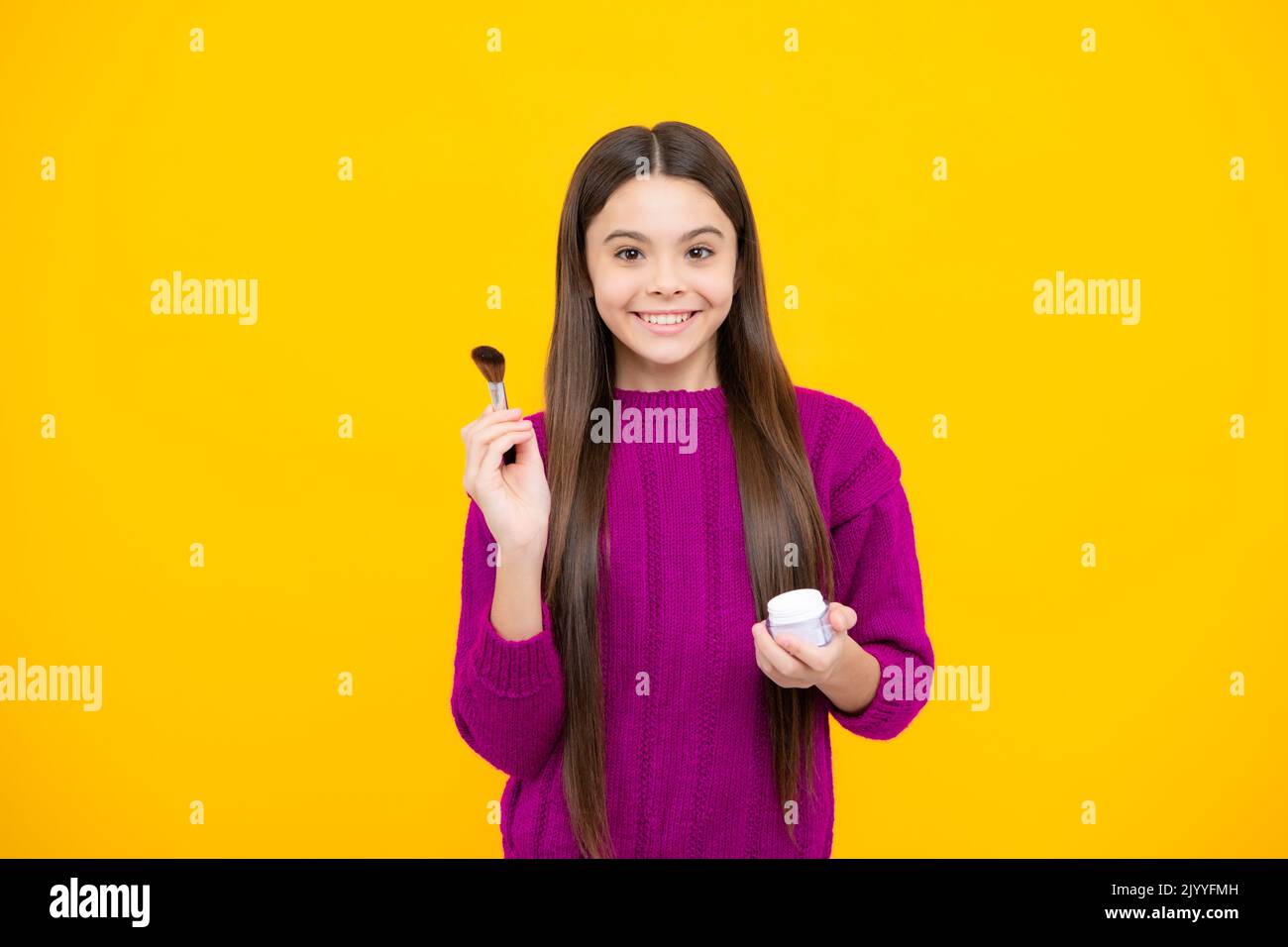 Kids make up products. Makeup teen child artist apply face powder with ...