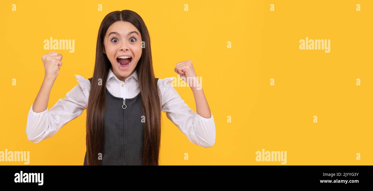 Happy teenage girl winner give winning gesture celebrating victory ...