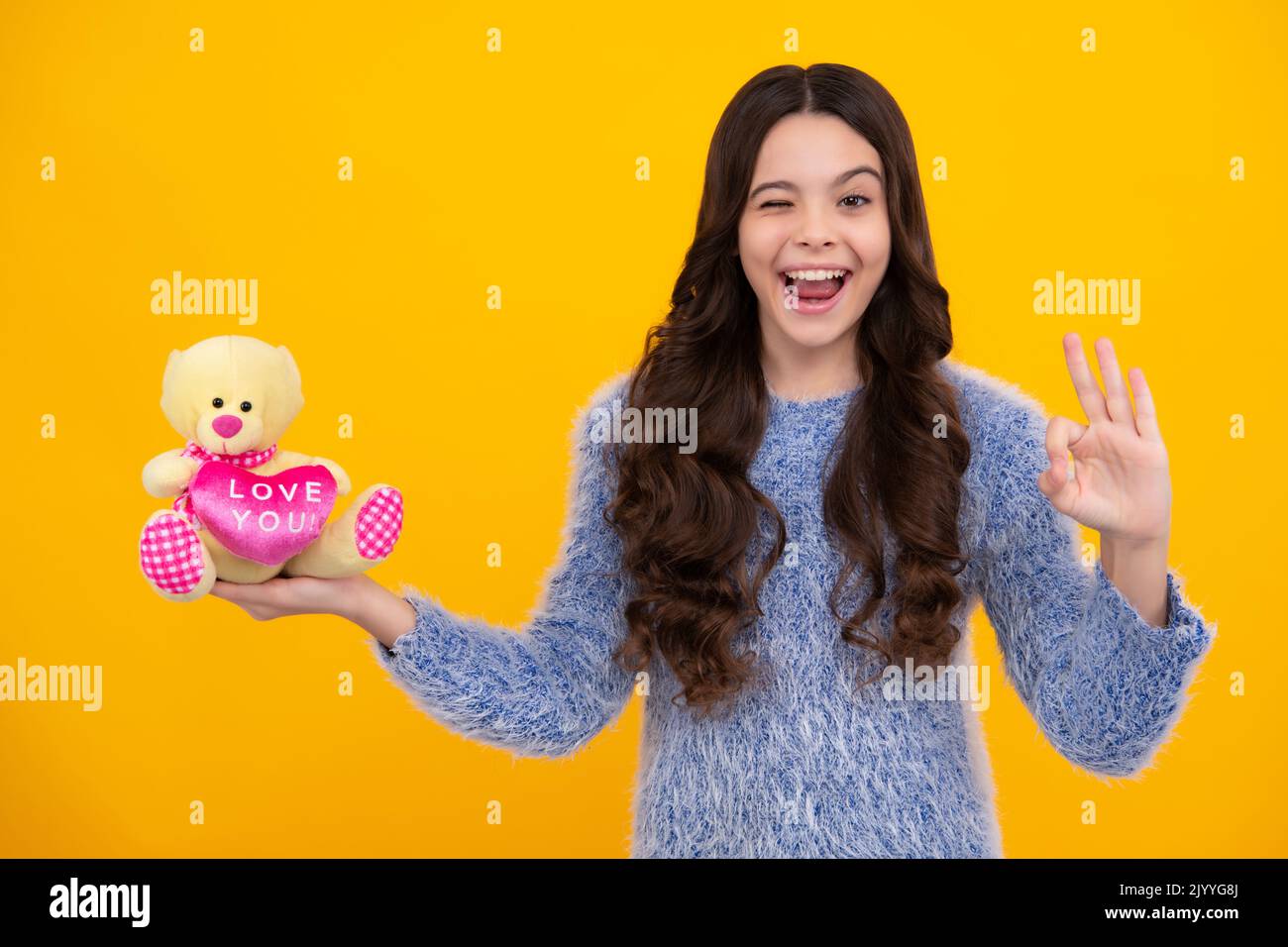 Teenage girl embracing toy. Childhood, toys and kids. Cute teen girl ...