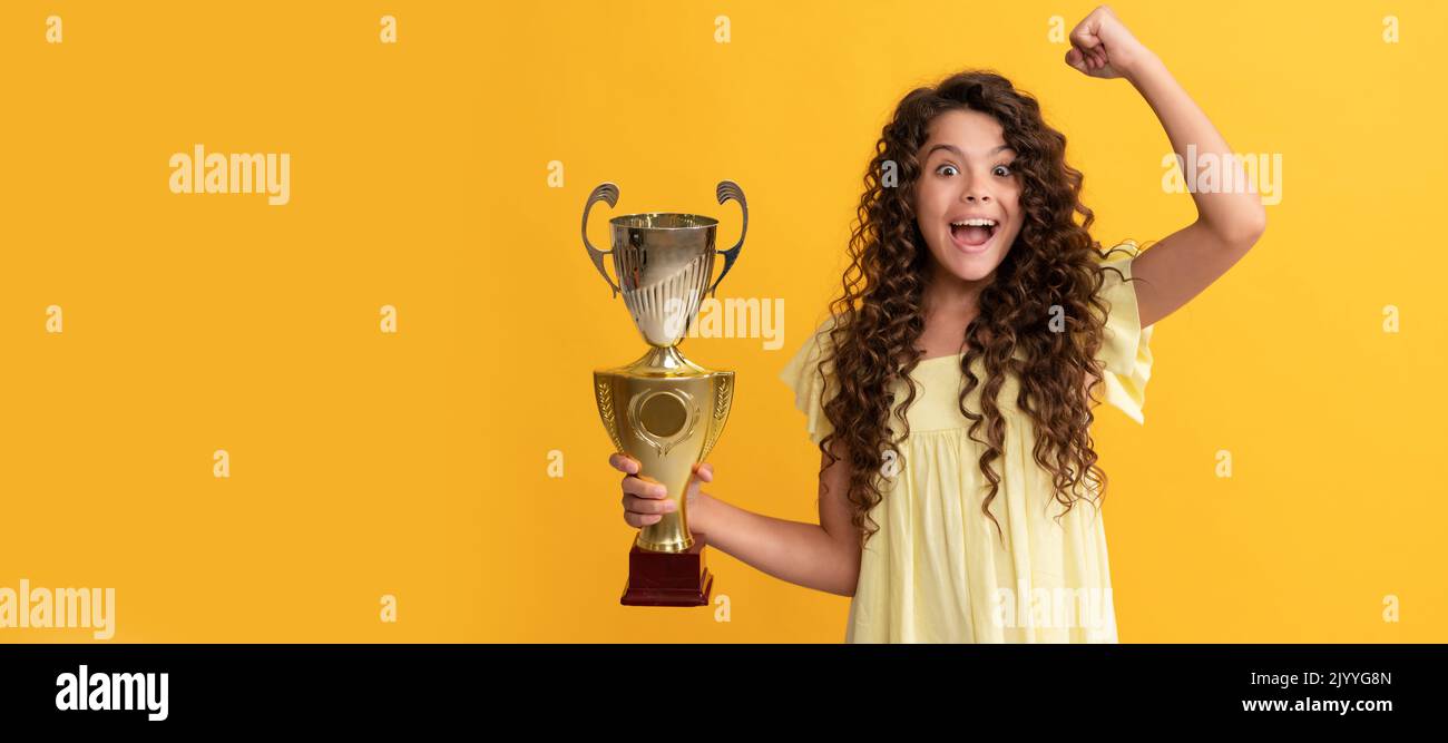 happiness. happy amazed teen girl hold golden cup. achievement award ...