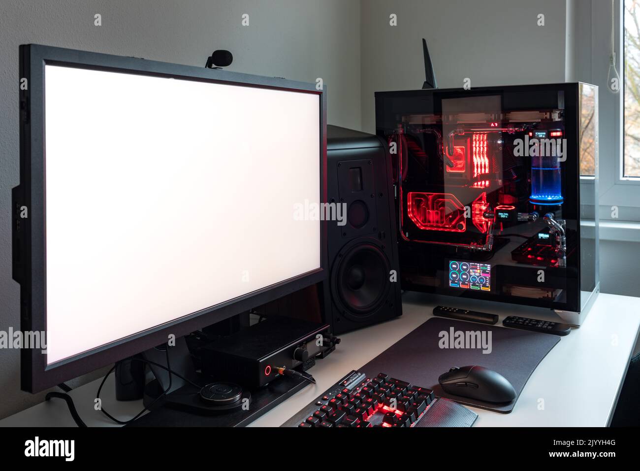 Powerful personal computer gamer rig with white screen. Professsional ...