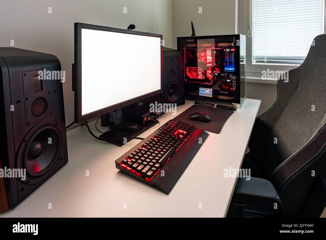 Powerful personal computer gamer rig with white screen. Professsional ...