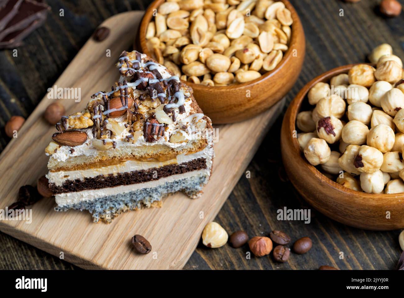 multi-layer cake with different layers, caramel, poppy seeds and cream ...