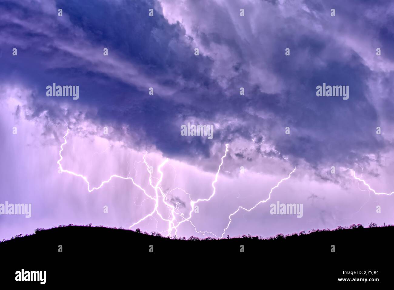 Lightning bolts striking the summit of Sullivan Butte in Chino Valley ...