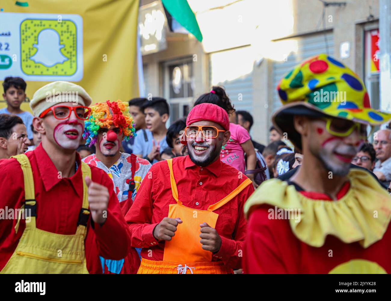 Gaza. 8th Sep, 2022. Palestinian young men dressed as clowns perform ...