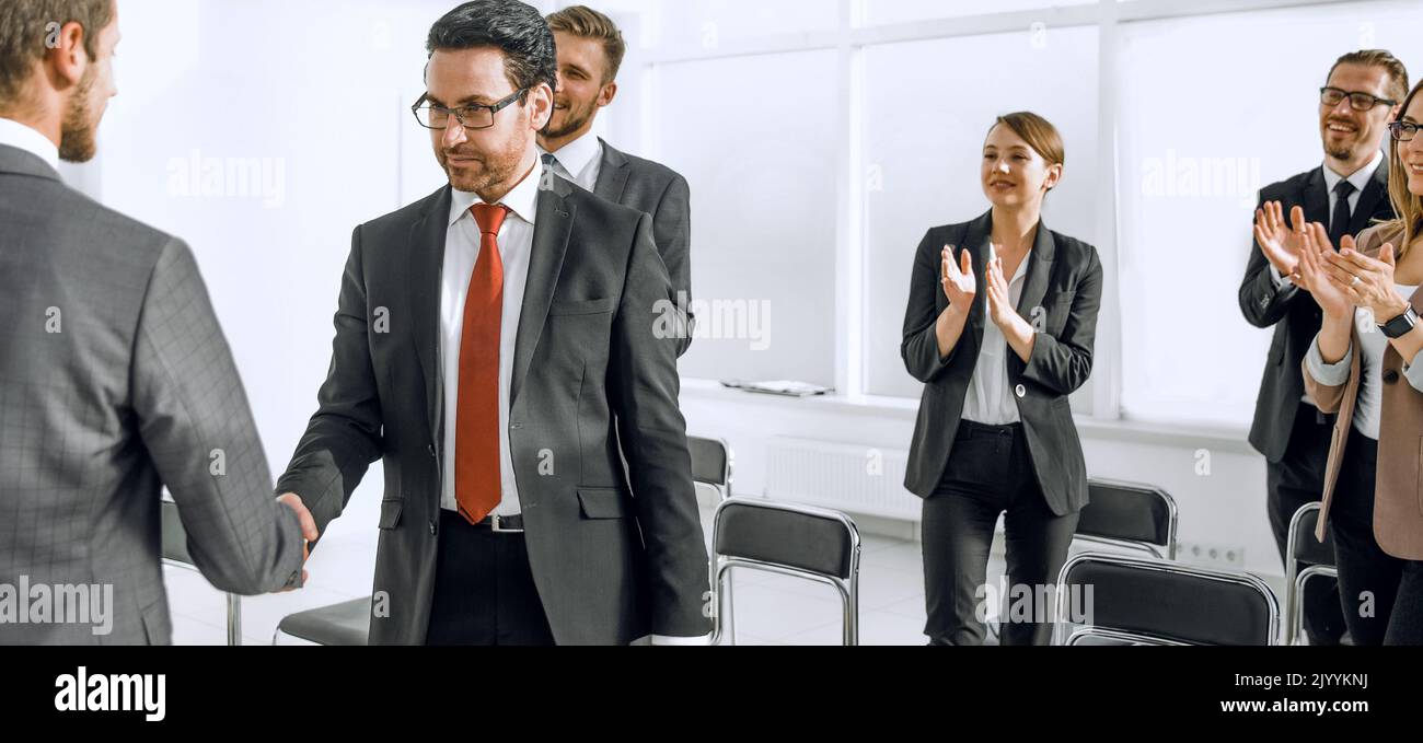handshake after the completion of a new project plan Stock Photo - Alamy