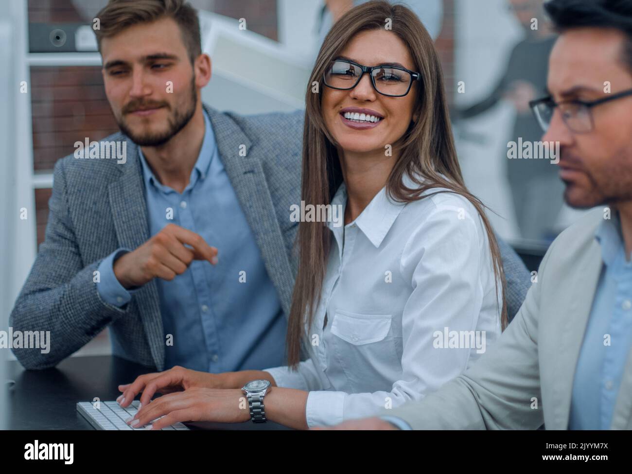 group of business people sitting at the office table Stock Photo - Alamy