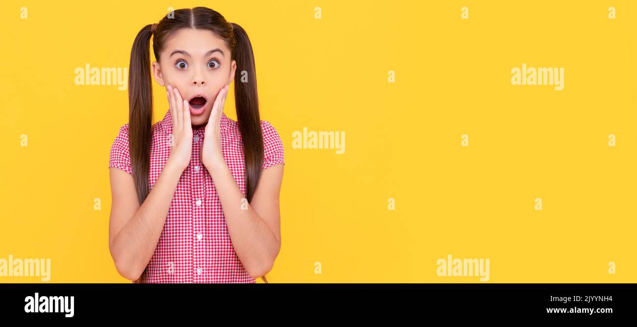 Kind of shocked. Kid got shocked. Surprised girl yellow background ...