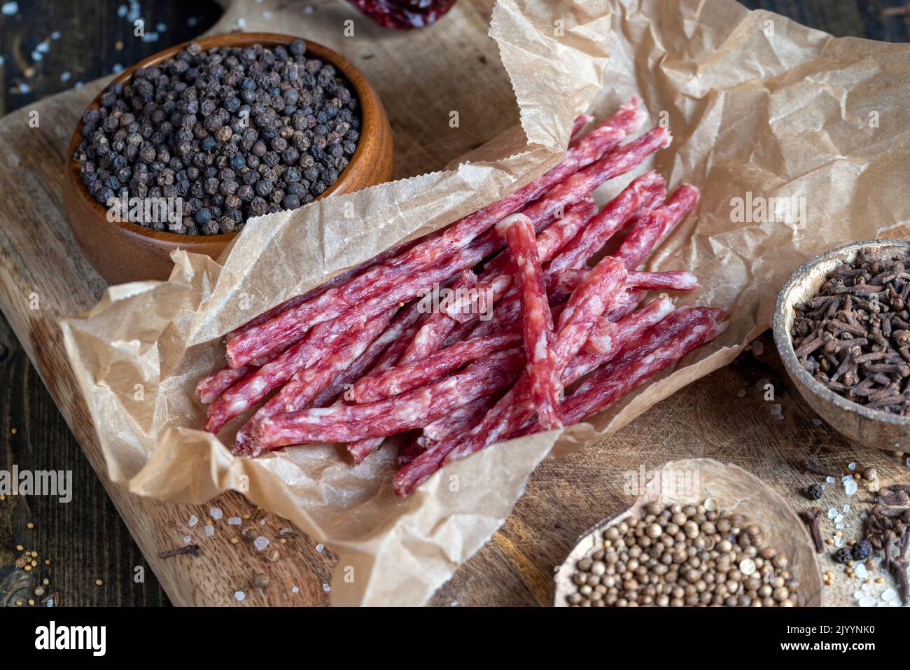 thin dried meat sausages with spices , dried pork meat food while ...