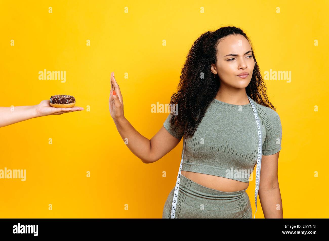 Confident sporty young beautiful hispanic or brazilian woman, stand on ...