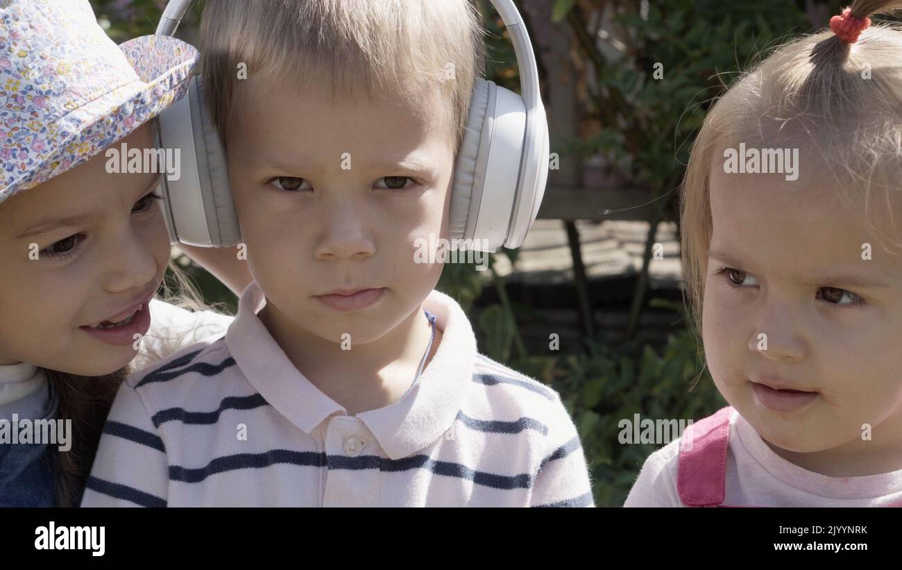 Three cute little Children enjoys delicious ice cream cone. Child ...