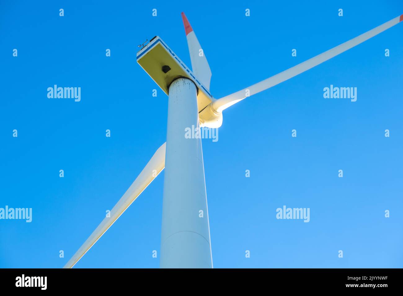 Wind generator on a blue sky background.Natural renewable clean energy ...