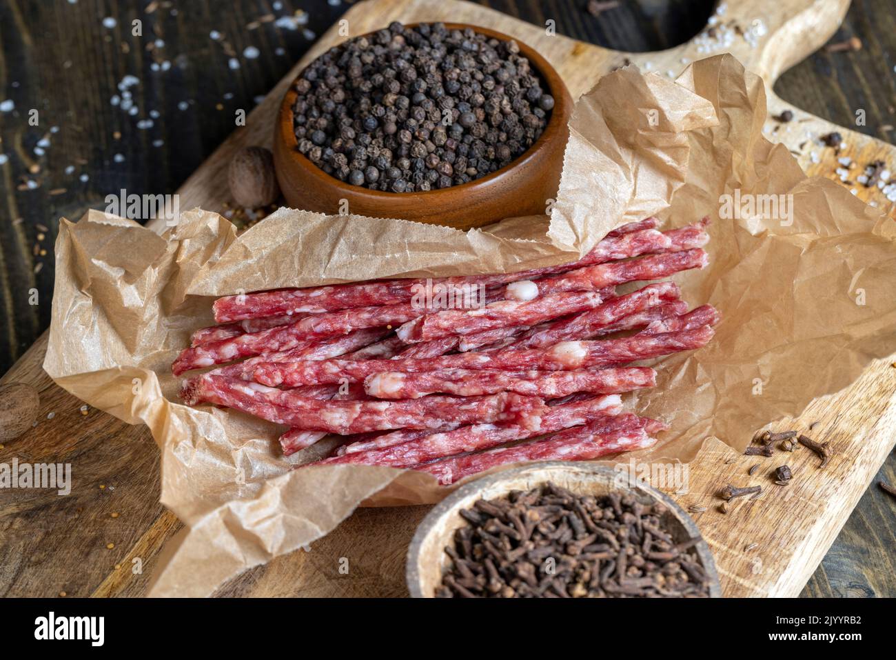 thin dried meat sausages with spices , dried pork meat food while ...