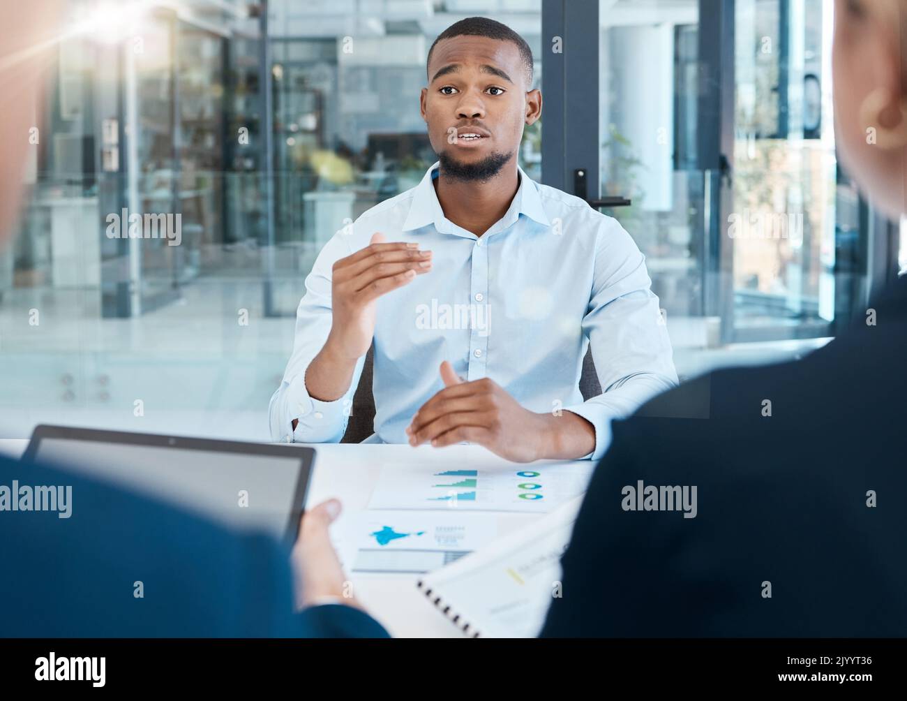 Black man, interview and office presentation to business team on ...