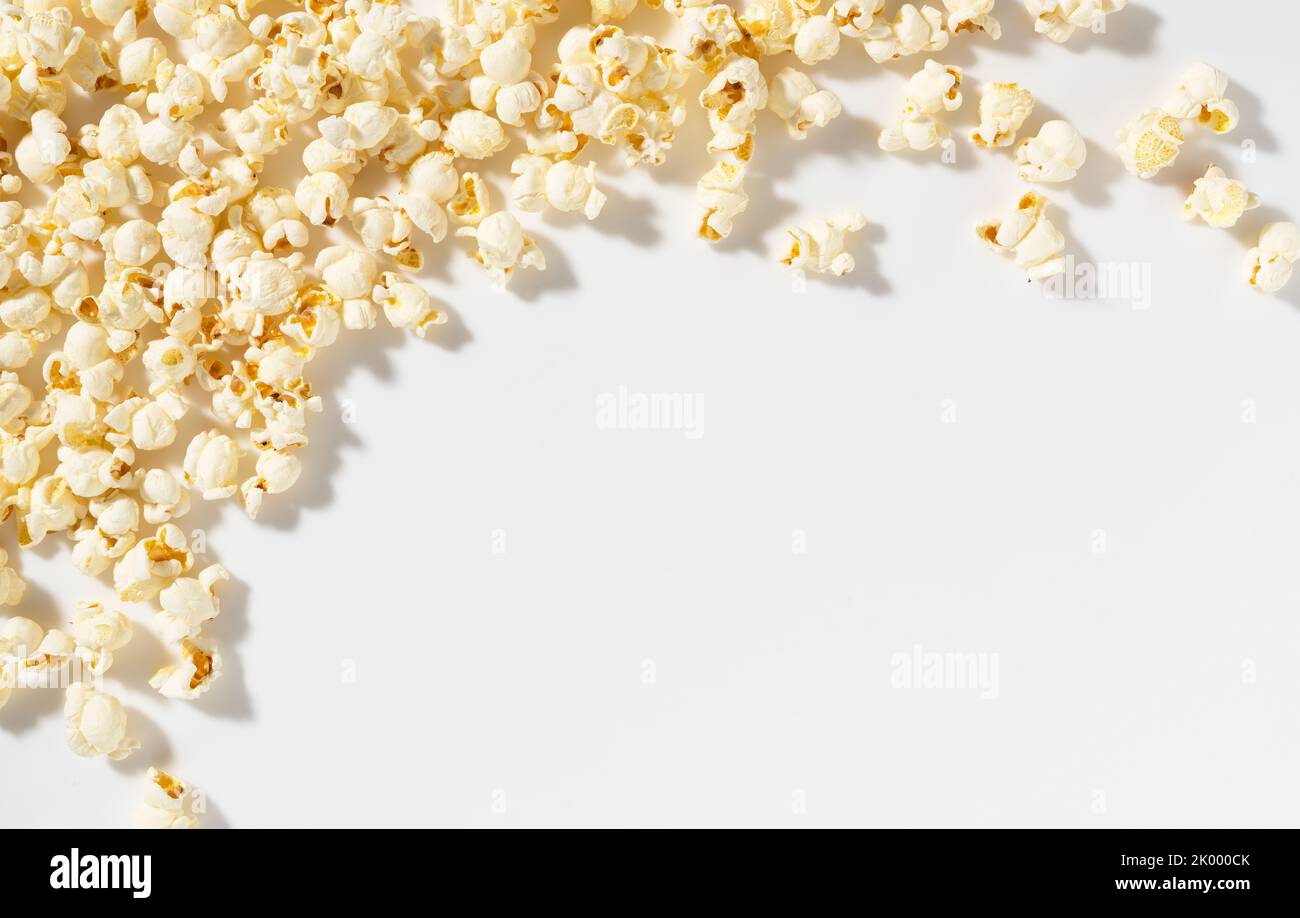 Popcorn placed on white background with copy space. Viewed from ...