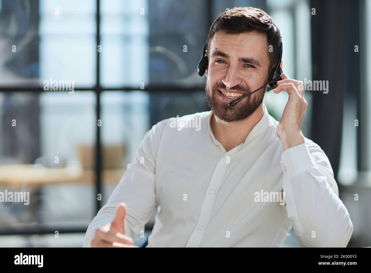 Hotline and helpdesk support operator working in office Stock Photo - Alamy