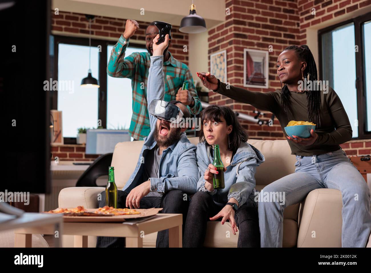 Group of people playing video games competition with vr glasses, using ...