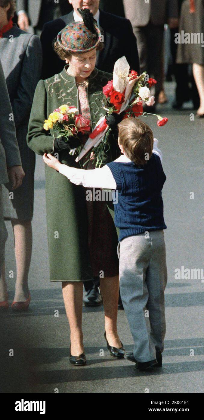 A young boy holds his arms out as he hopes for a royal hug from Queen ...