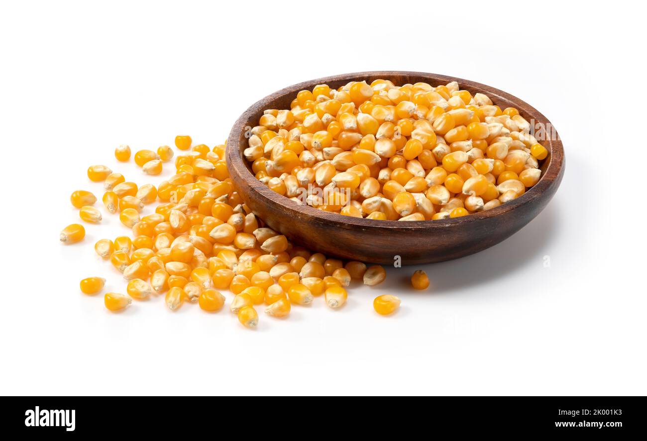 Dried corn kernels in wooden bowl placed on white background. Corn for ...
