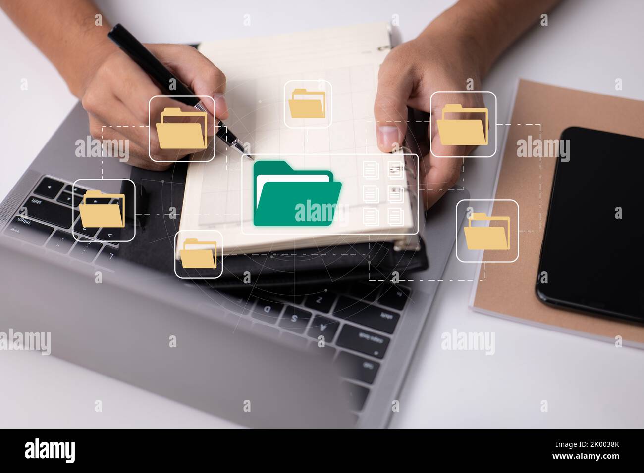 Paperless office concept based on e-documents. A businessman types on a laptop keyboard while ...