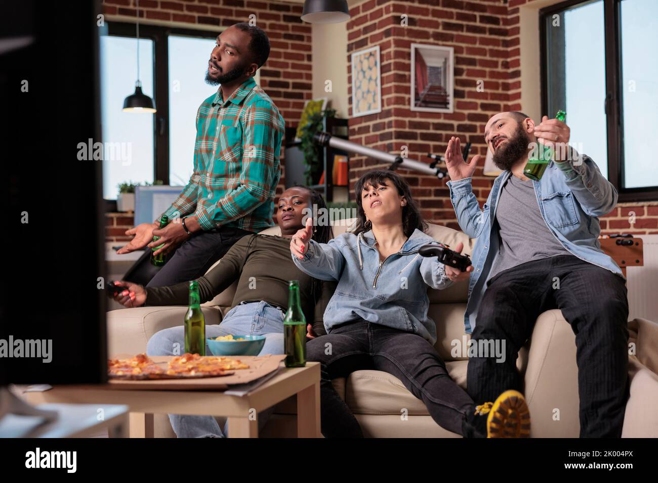 Competitive group of people losing video games play on tv console ...