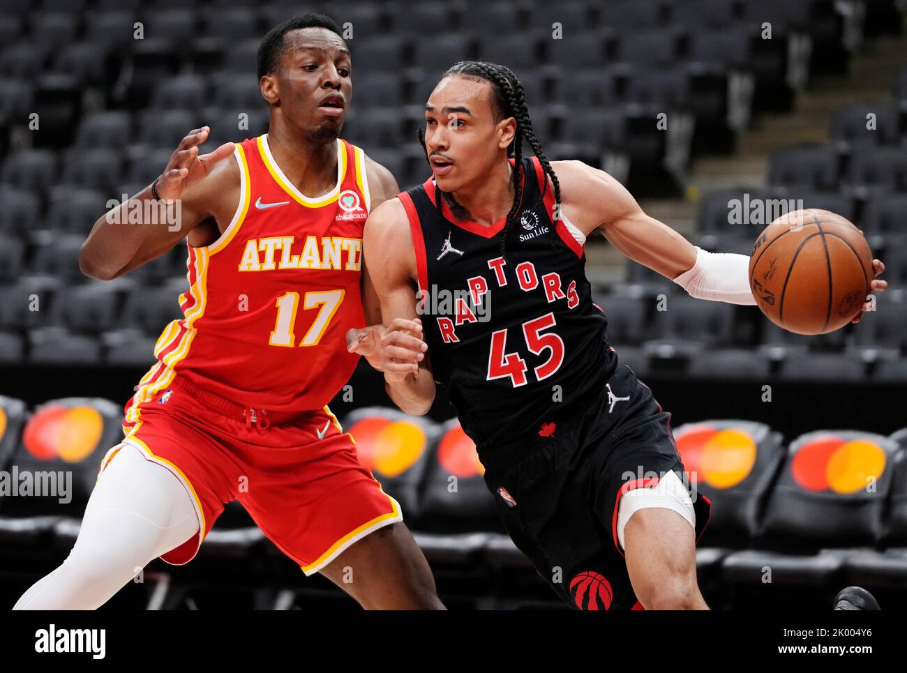 Toronto Raptors guard Dalano Banton (45) protects the ball from Atlanta ...