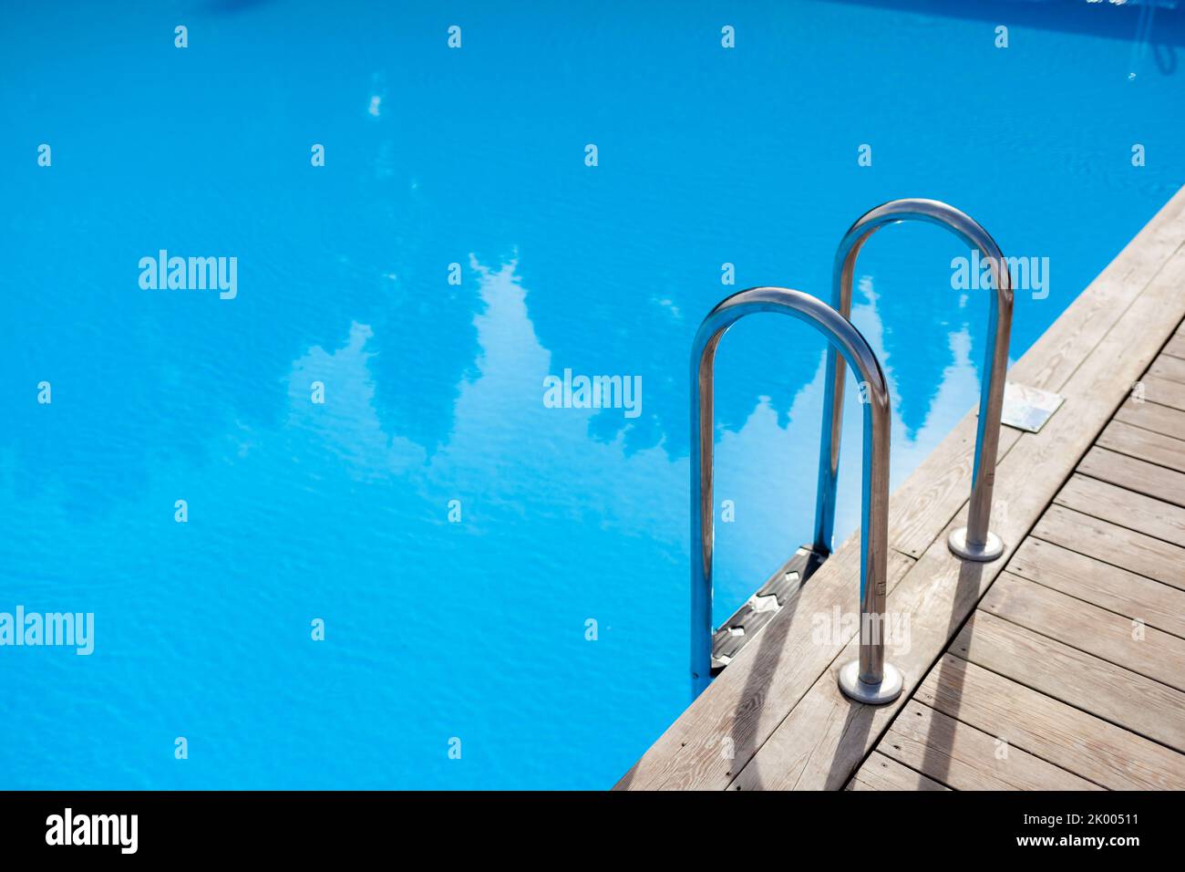 Ladder stainless handrails for descent into swimming pool. Swimming ...