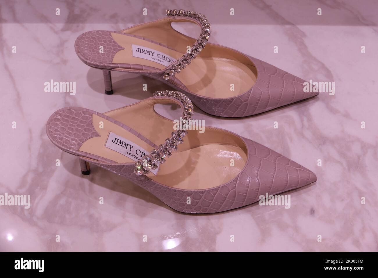 JIMMY CHOO SHOES ON DISPLAY INSIDE A FASHION STORE Stock Photo - Alamy