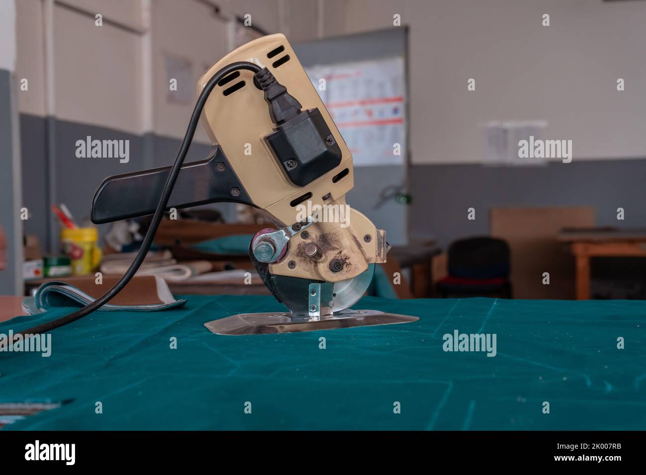 Disc cutting knife for cutting fabric in the sewing workshop Stock ...