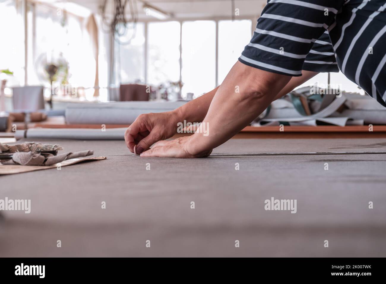 The cutter marks the fabric for cutting in the sewing workshop Stock ...
