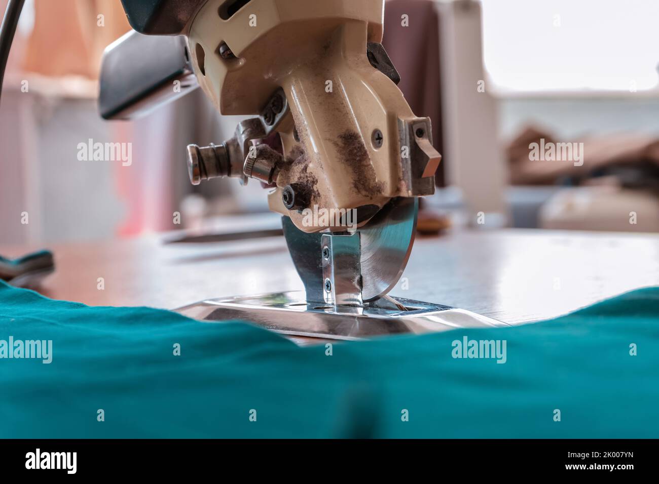Disc cutting knife for cutting fabric in the sewing workshop Stock ...