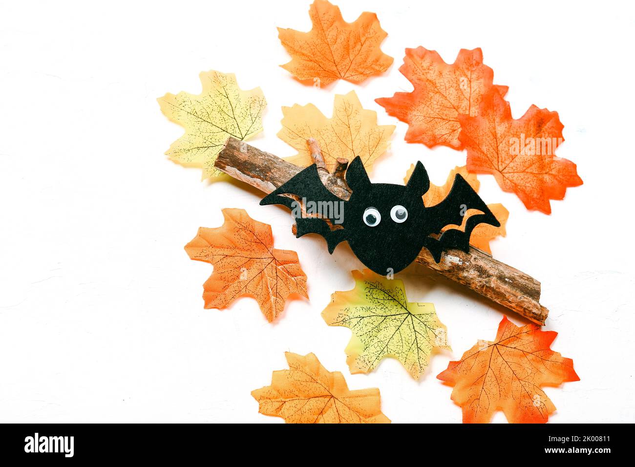 Autumn background. Autumn leaves and bat. Happy Halloween Stock Photo ...