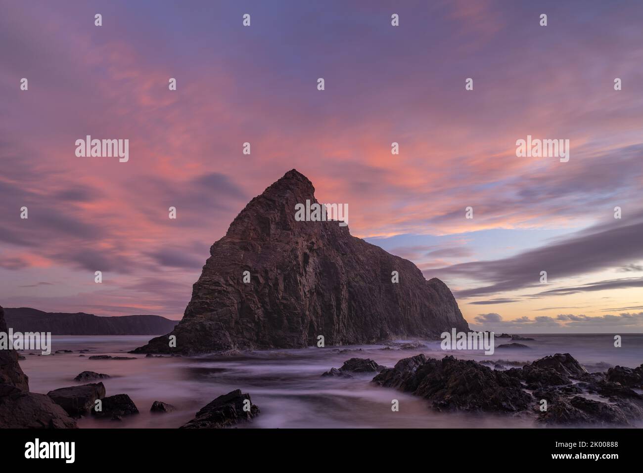 late sunset shot of lion rock at south cape bay in the wilderness of ...