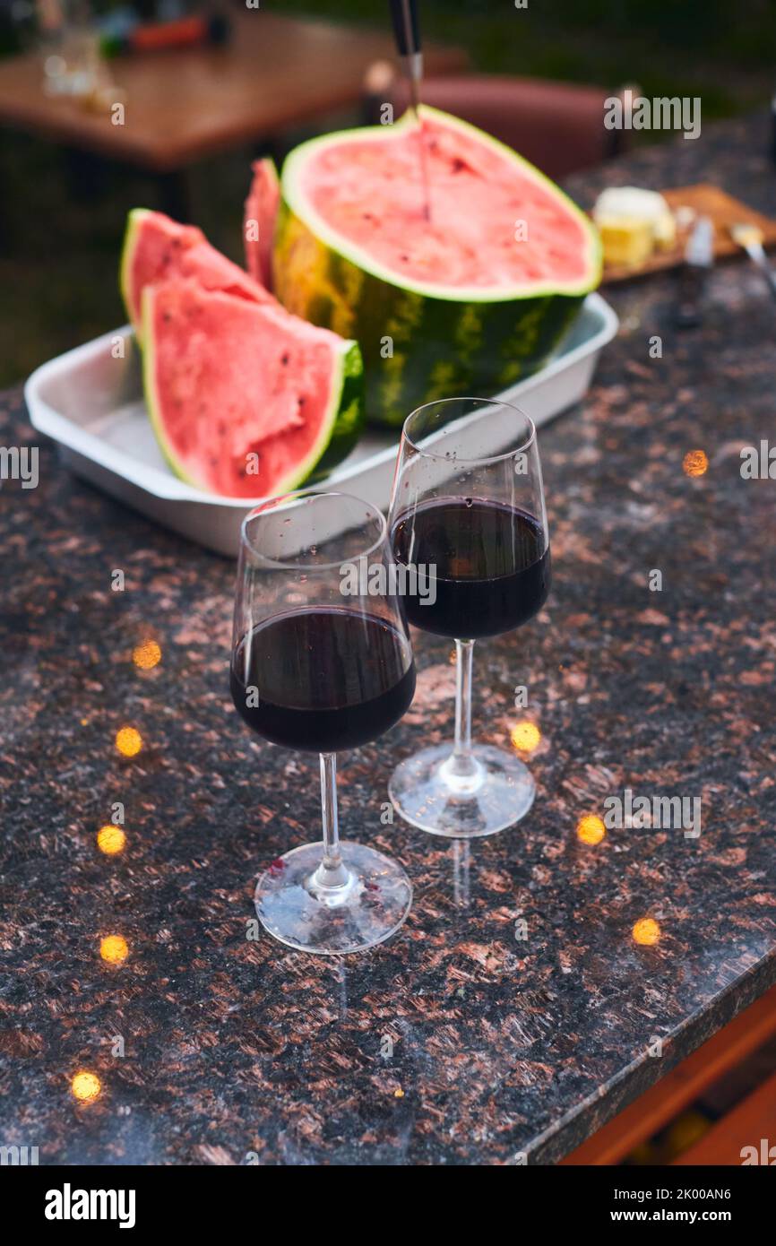 Juicy red watermelon and red wine. The concept of summer and delicious ...