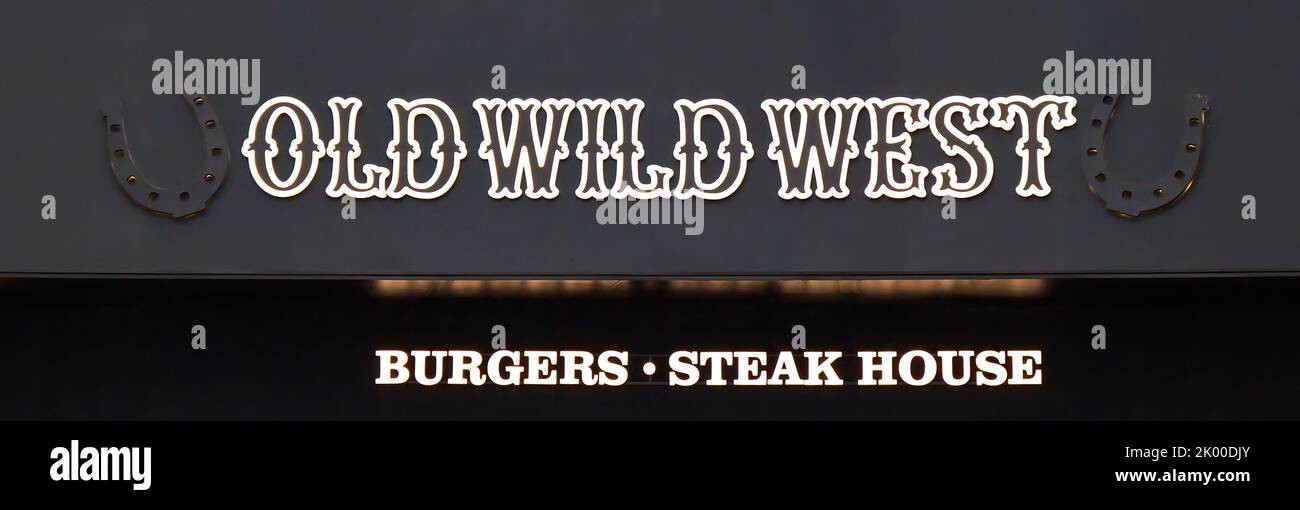Old Wild West, logo on a facade. Burgers and Steak House Stock Photo ...