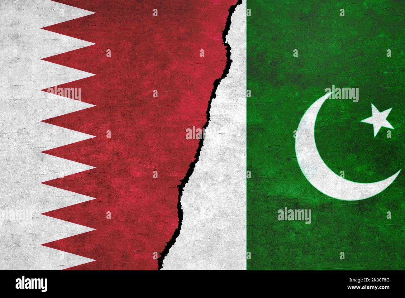Pakistan and Qatar flags on a wall with a crack. Qatar and Pakistan ...