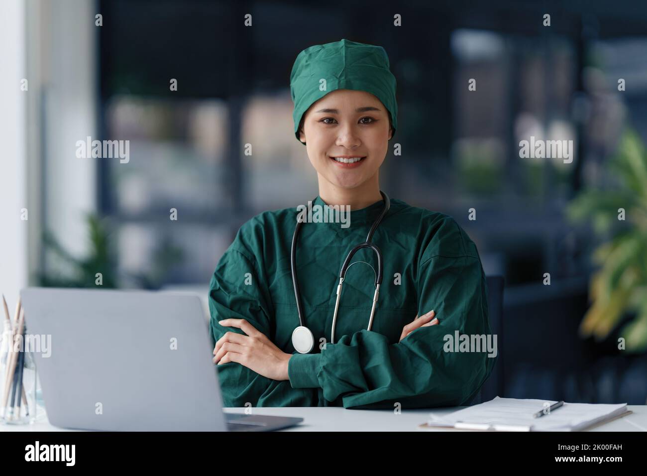 Doctor working with laptop at clinic. Medical technology and network ...