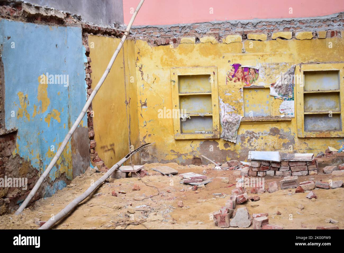 Yellow wall of a damaged building. Concept - indian street photography ...