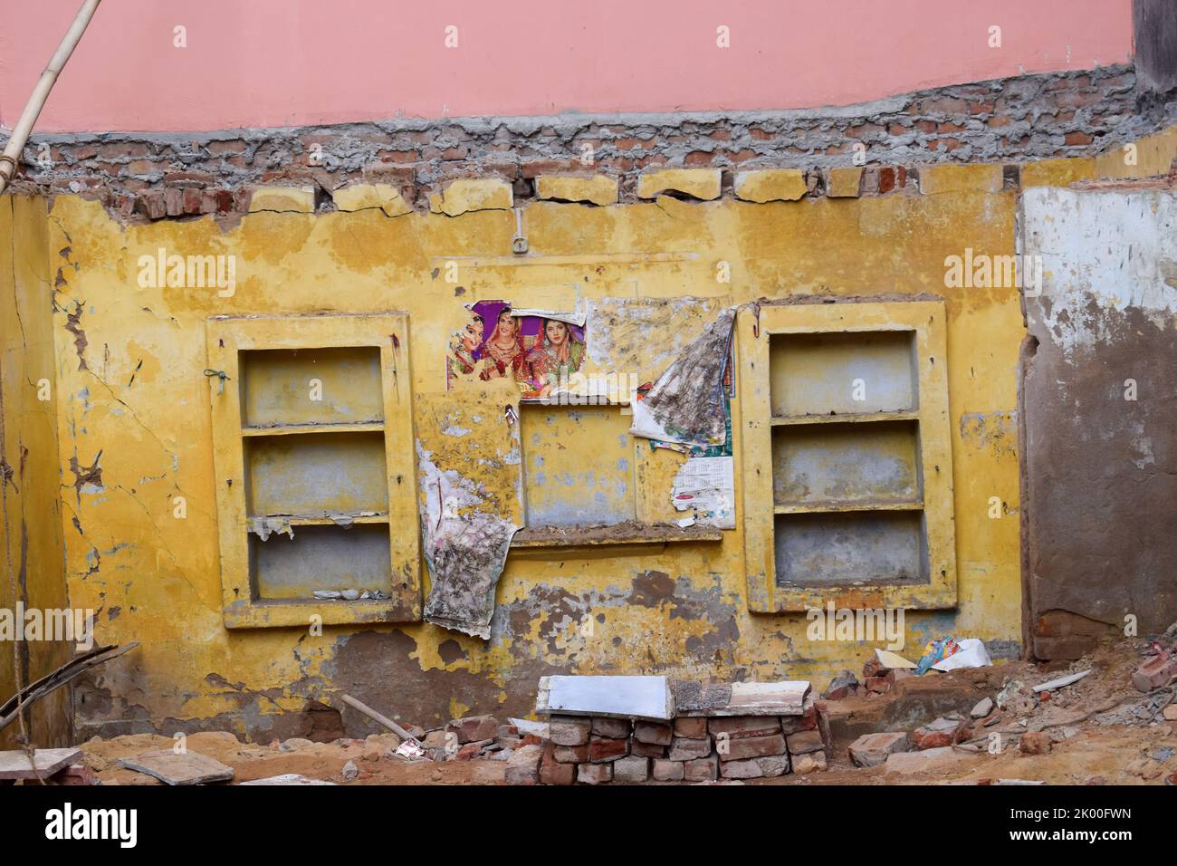 Yellow wall of a damaged building. Concept - indian street photography ...