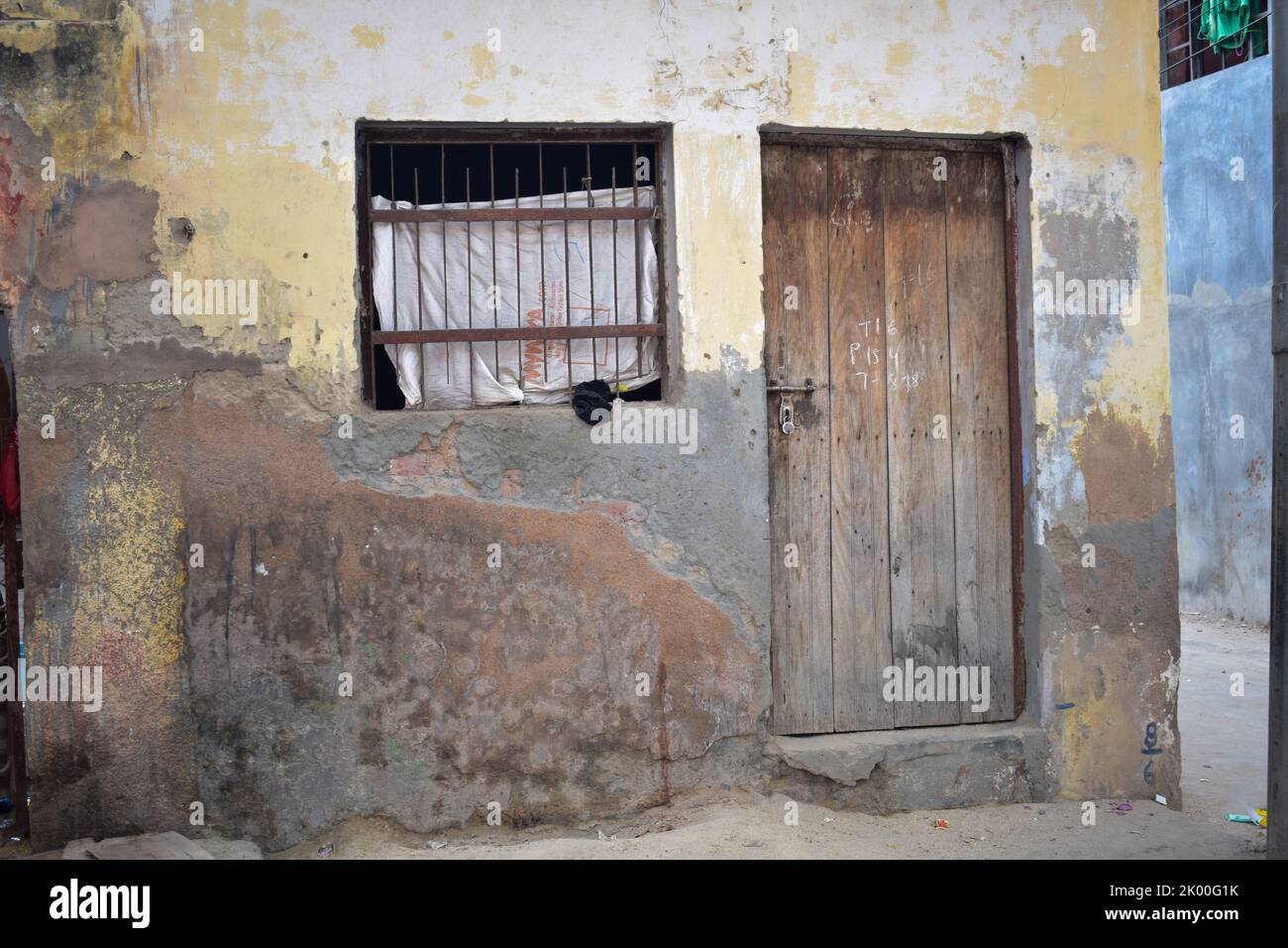 Yellow wall of a damaged building. Concept - indian street photography ...