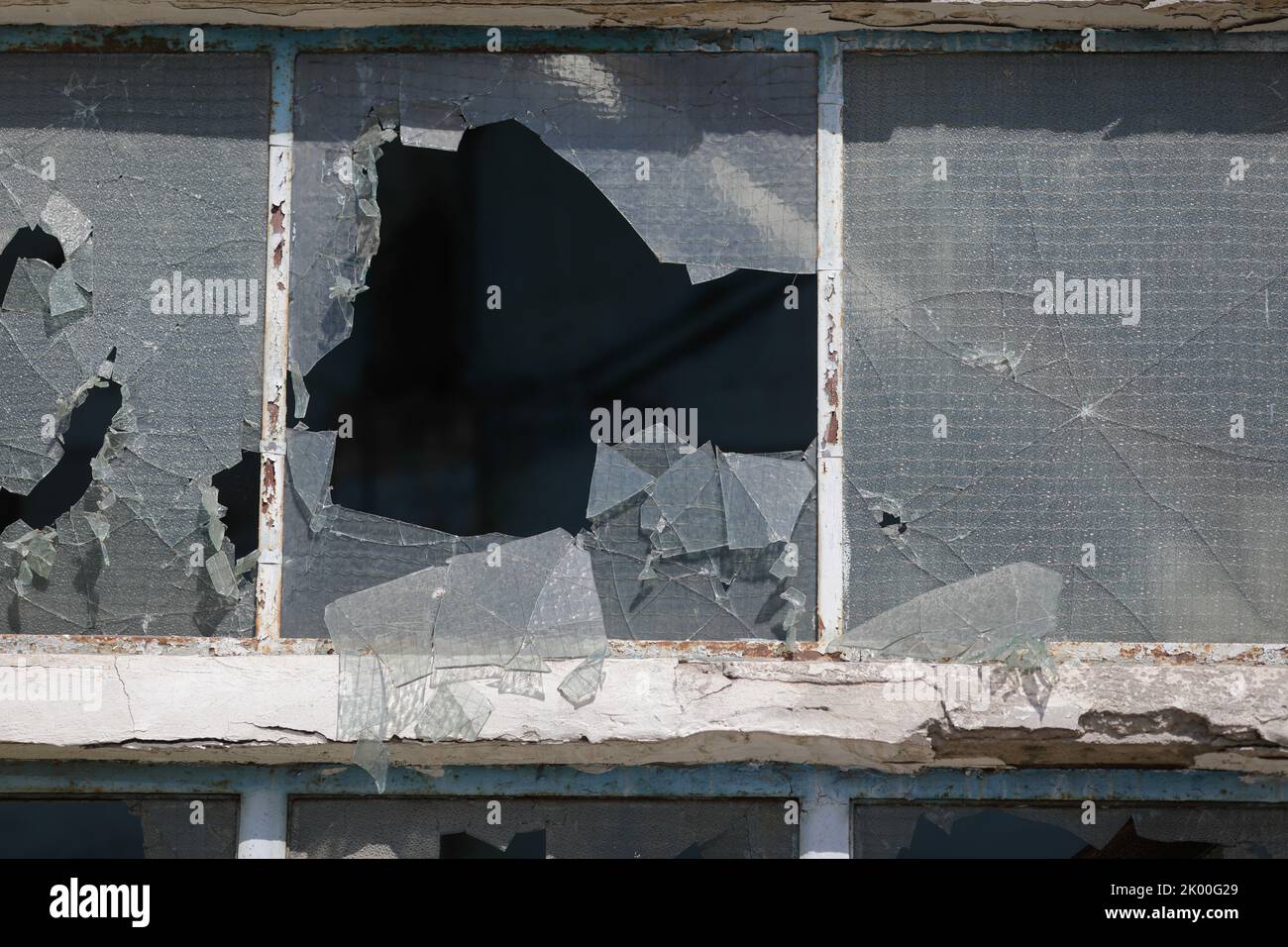 Broken walls and windows in an abandoned industrial building Stock Photo - Alamy