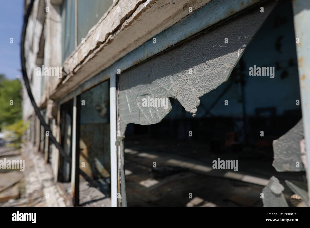 Broken walls and windows in an abandoned industrial building Stock Photo - Alamy