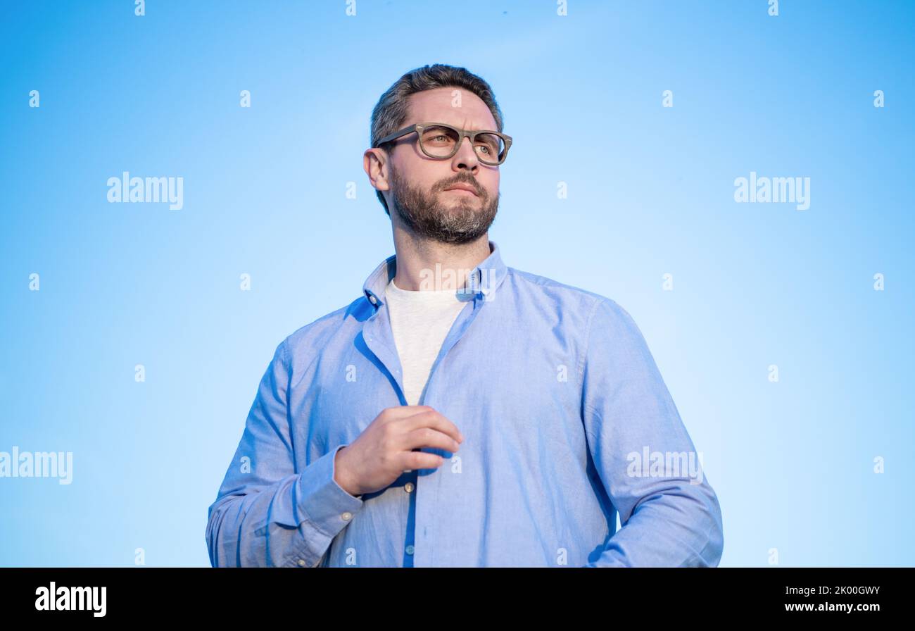 pensive bearded man standing peaceful. pensive man in glasses outdoor ...