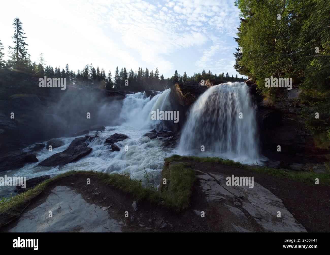 Waterfall in a mighty river in the woodland, mountain. Rocks, cliffs ...