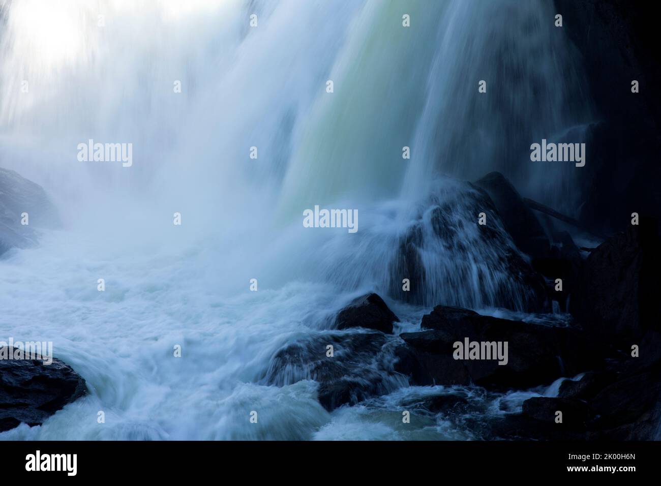 Waterfall in a mighty river in the woodland, mountain. Rocks, cliffs ...